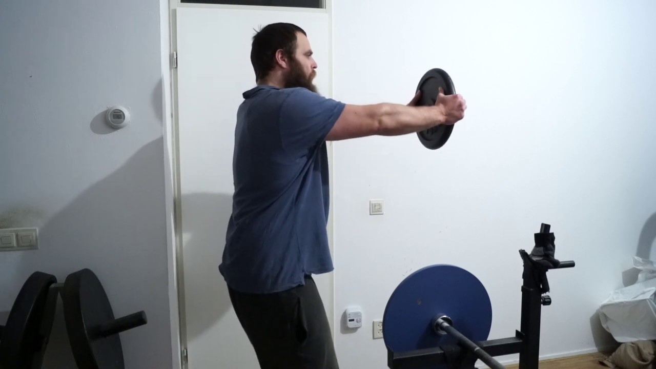 15 KG plate front raise hold and twisting - YouTube
