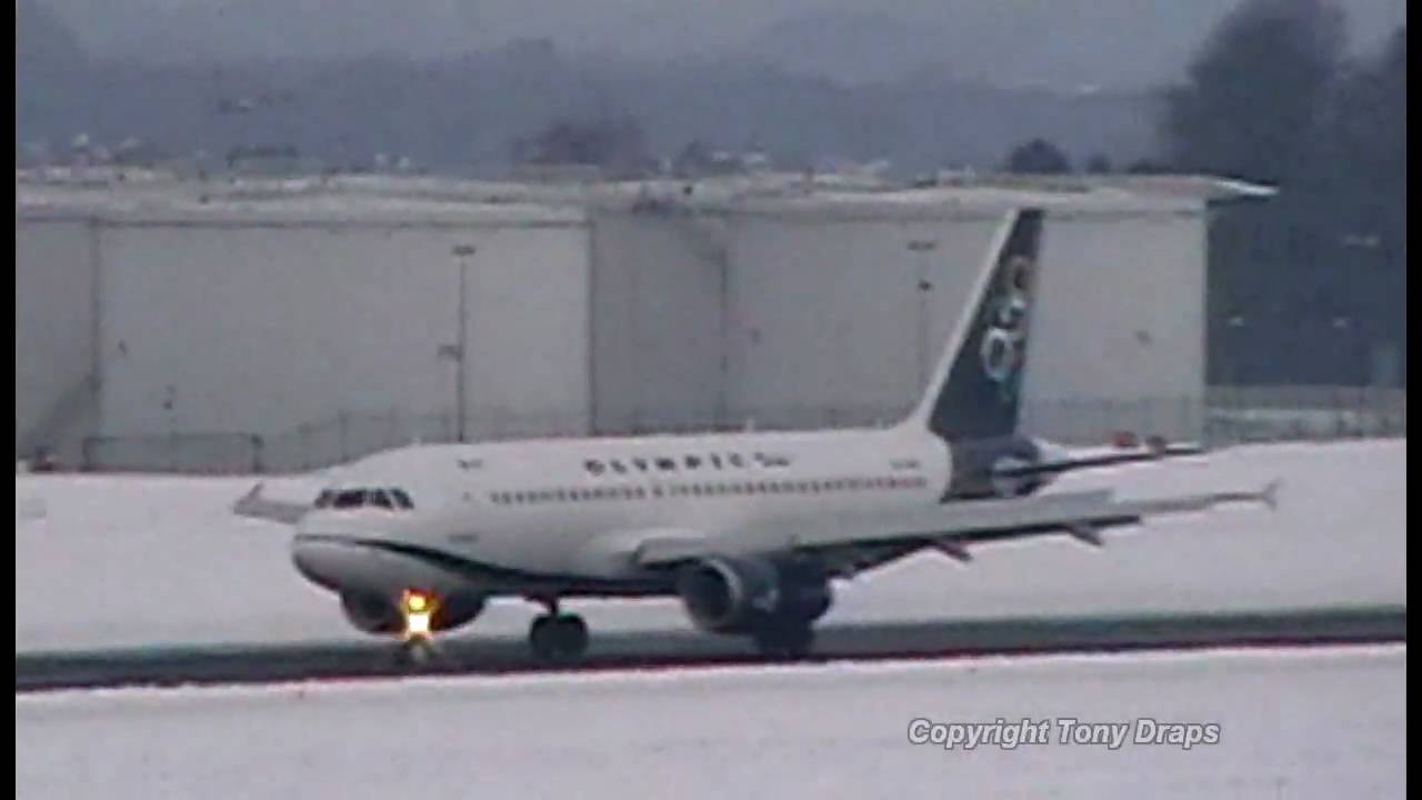 Landing Airbus A320 Olympic Airlines on Brussels Airport at snow - YouTube