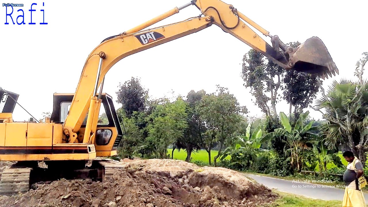 Video of cutting soil with a vehicle on the side road soil excavation ...