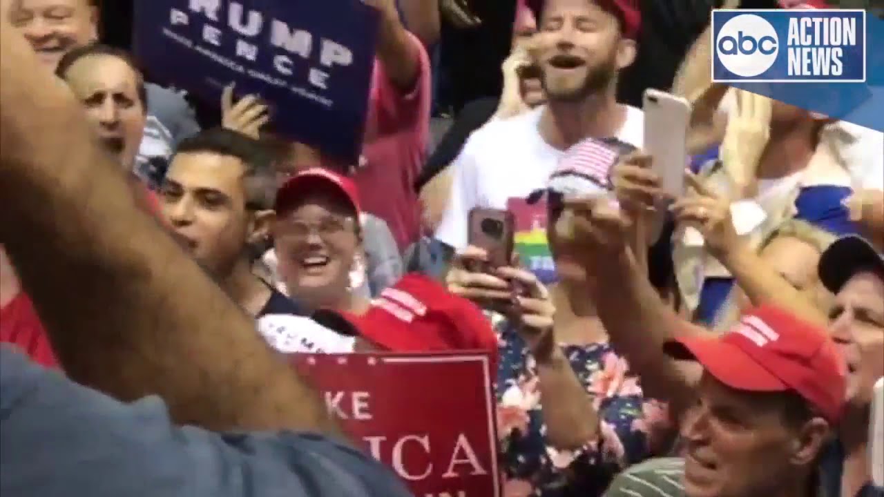 Angry crowd gather yells "CNN sucks!" during Jim Acosta's live shot at ...