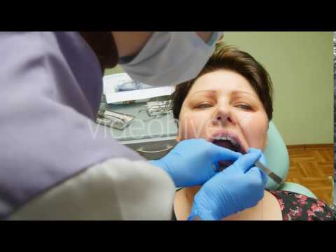 Young Woman With Dentist Pulling Tooth - Stock Footage | VideoHive ...