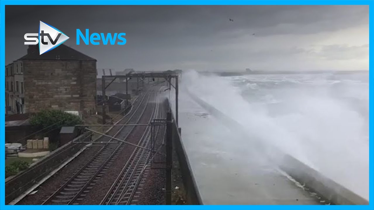 Trains cancelled as waves crash onto overhead wires - YouTube