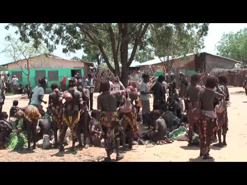 Hamer people and Karo tribe - native African tribes meet at Turmi market in Ethiopia