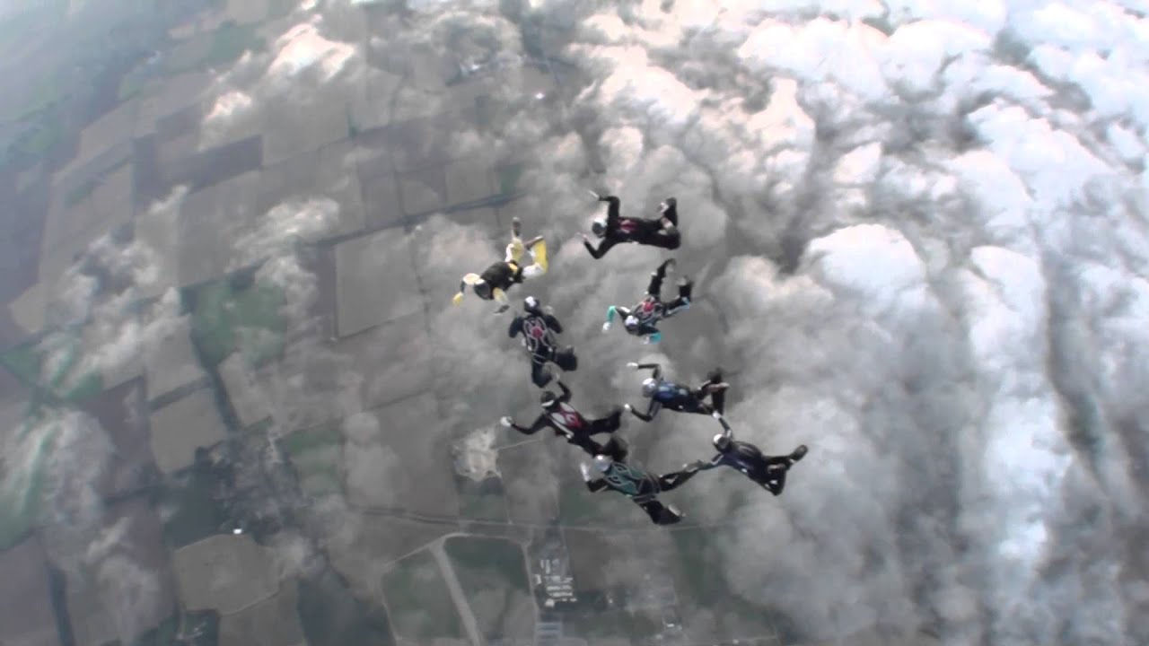 0.09 - 8-way Formation Skydiving Team - YouTube