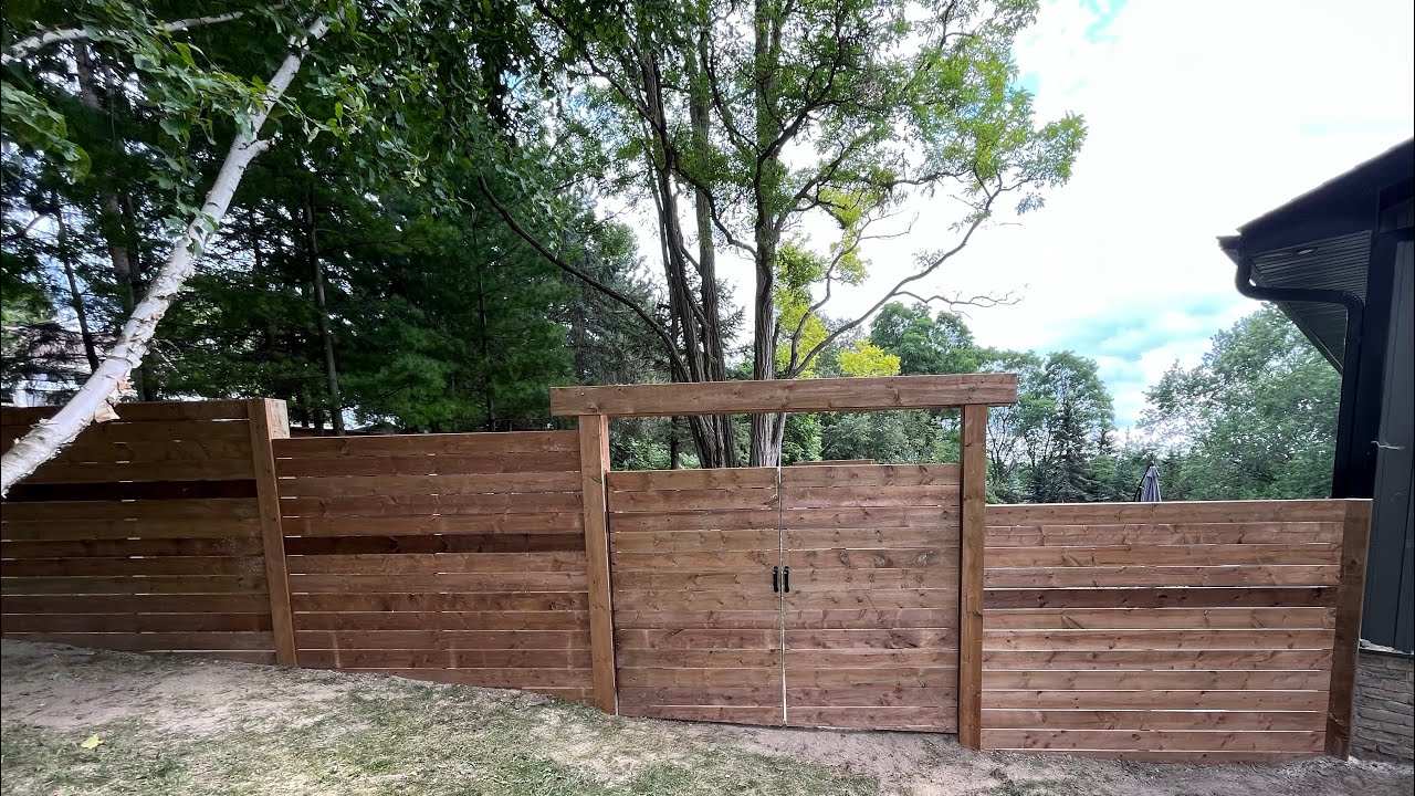 Horizontal fence with two sets of double gates - YouTube