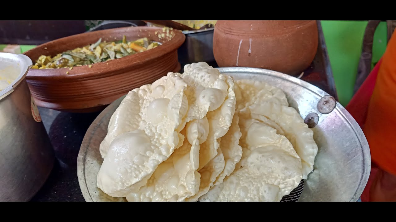Kerala food cooking class - pappadam sliding into the oil - YouTube