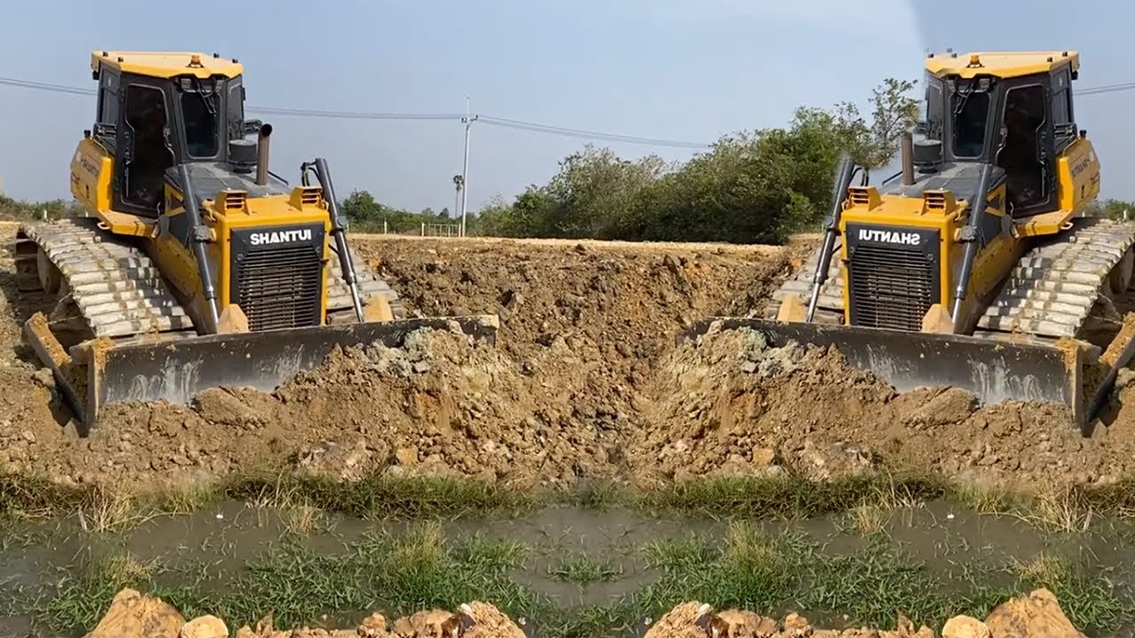 Great work operator SHANTUI bulldozer clearing and pushing dirt and ...