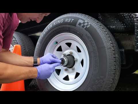 How to repack trailer wheel bearings with grease on a Sure-Trac trailer ...