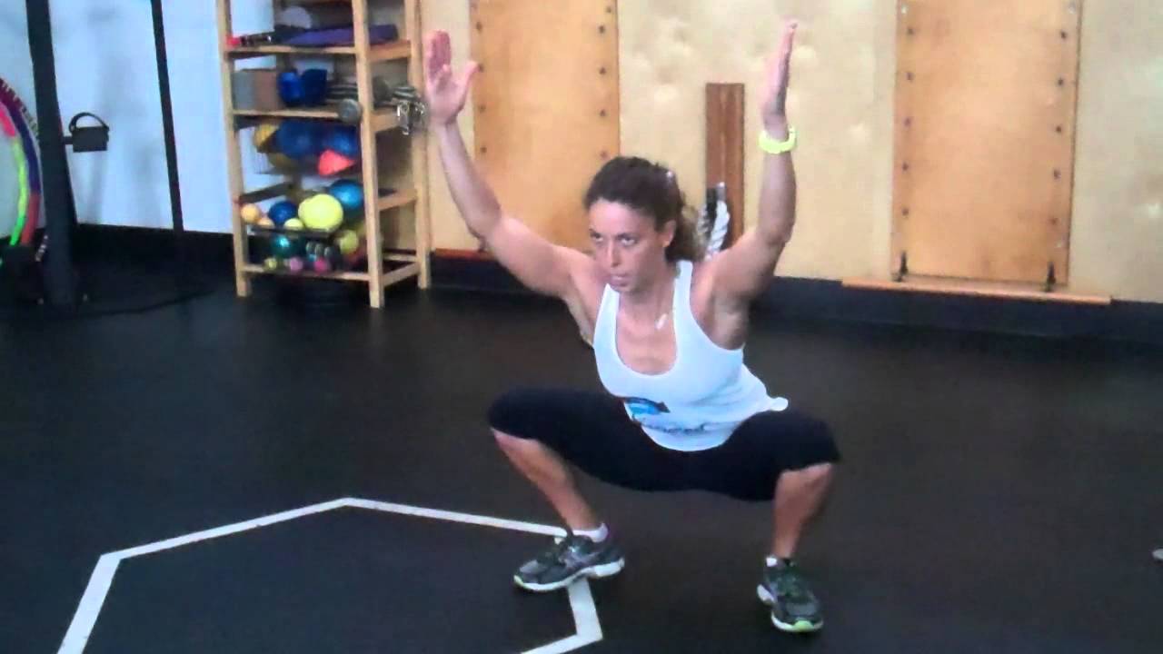 sumo squat with single arm raises - YouTube