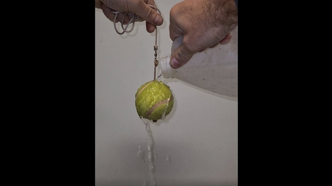 Spinning wet tennis ball - YouTube