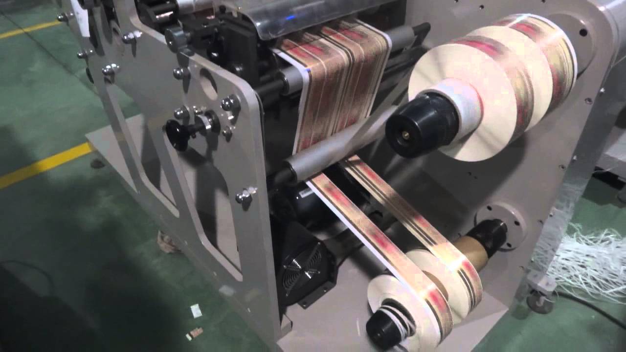 DK320G lable slitting machine with rotary die cutting station 1 - YouTube