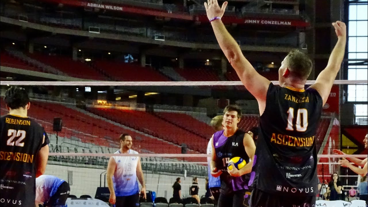 Vince Zanzucchi with the stuff block off the shoulder of Madison Hayden ...