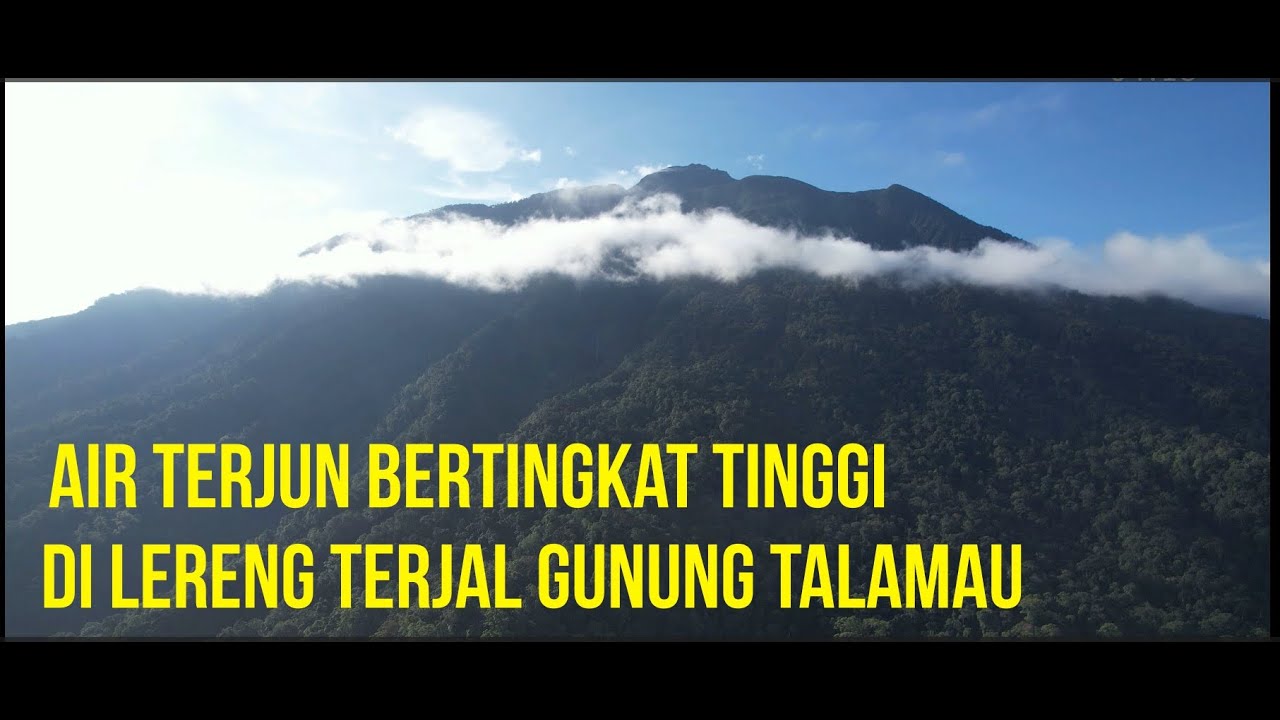 MOUNT TALAMAU: DRONE FLIES UP STEEP SLOPES TO SEE TOWERING CASCADING ...