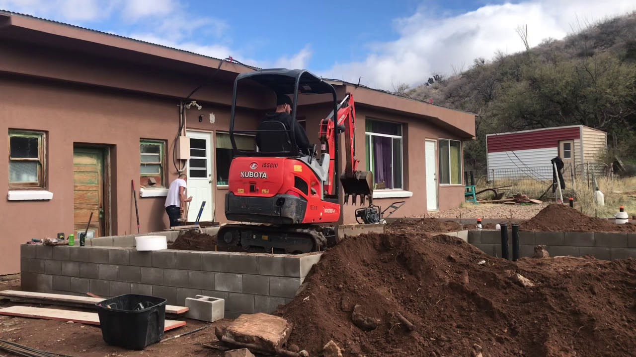 Excavator grading - YouTube