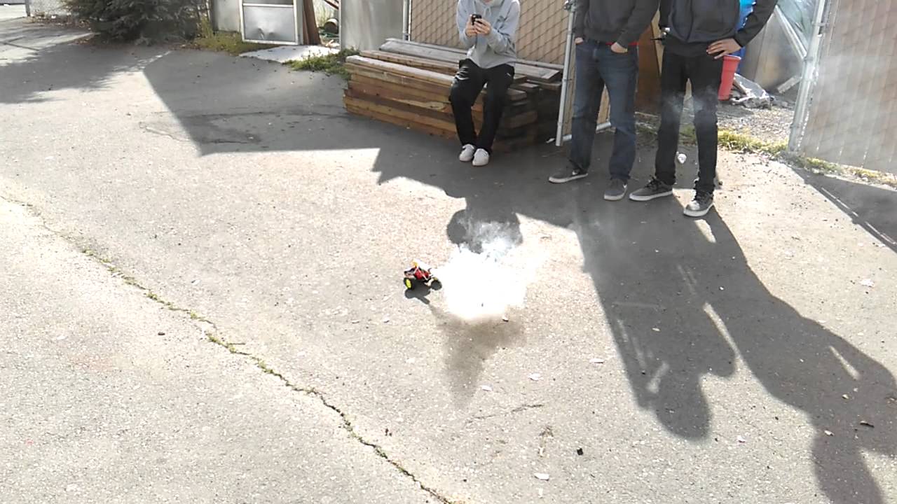 Homemade rocket strapped to two wheeled car - YouTube