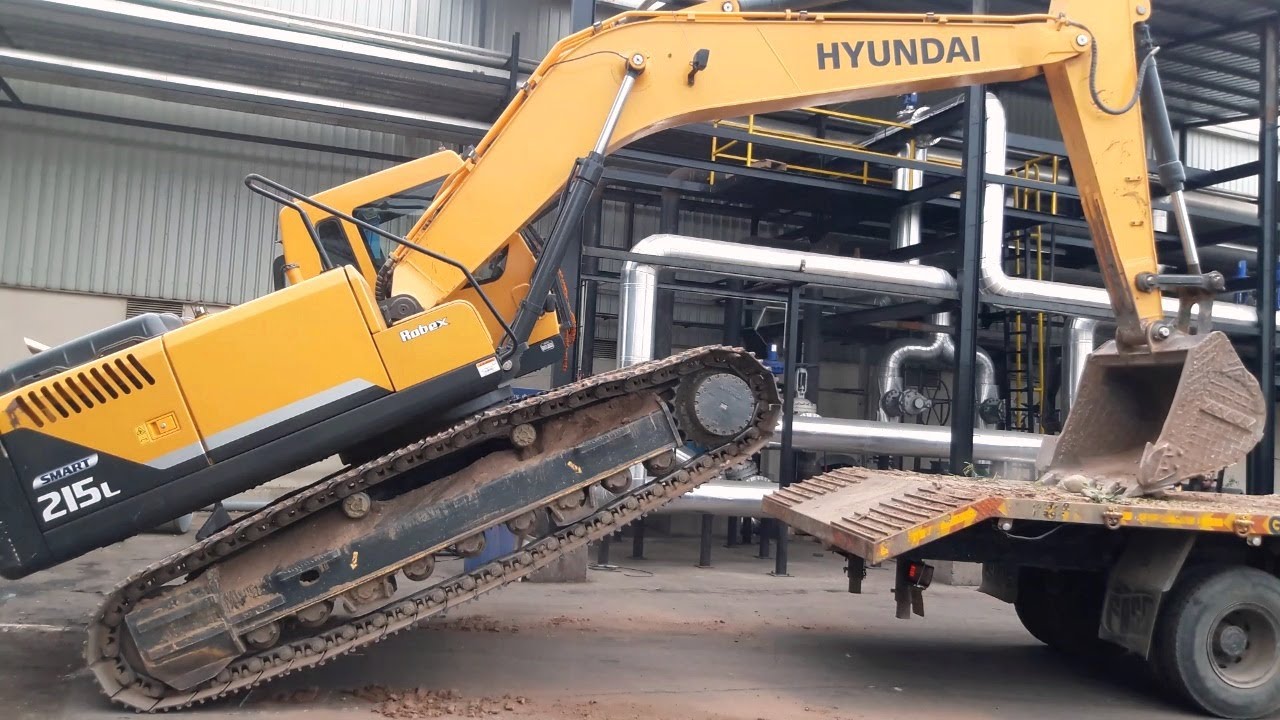 Unloading Hyundai Poclain Machine to Tata Truck in Amazing Style - YouTube