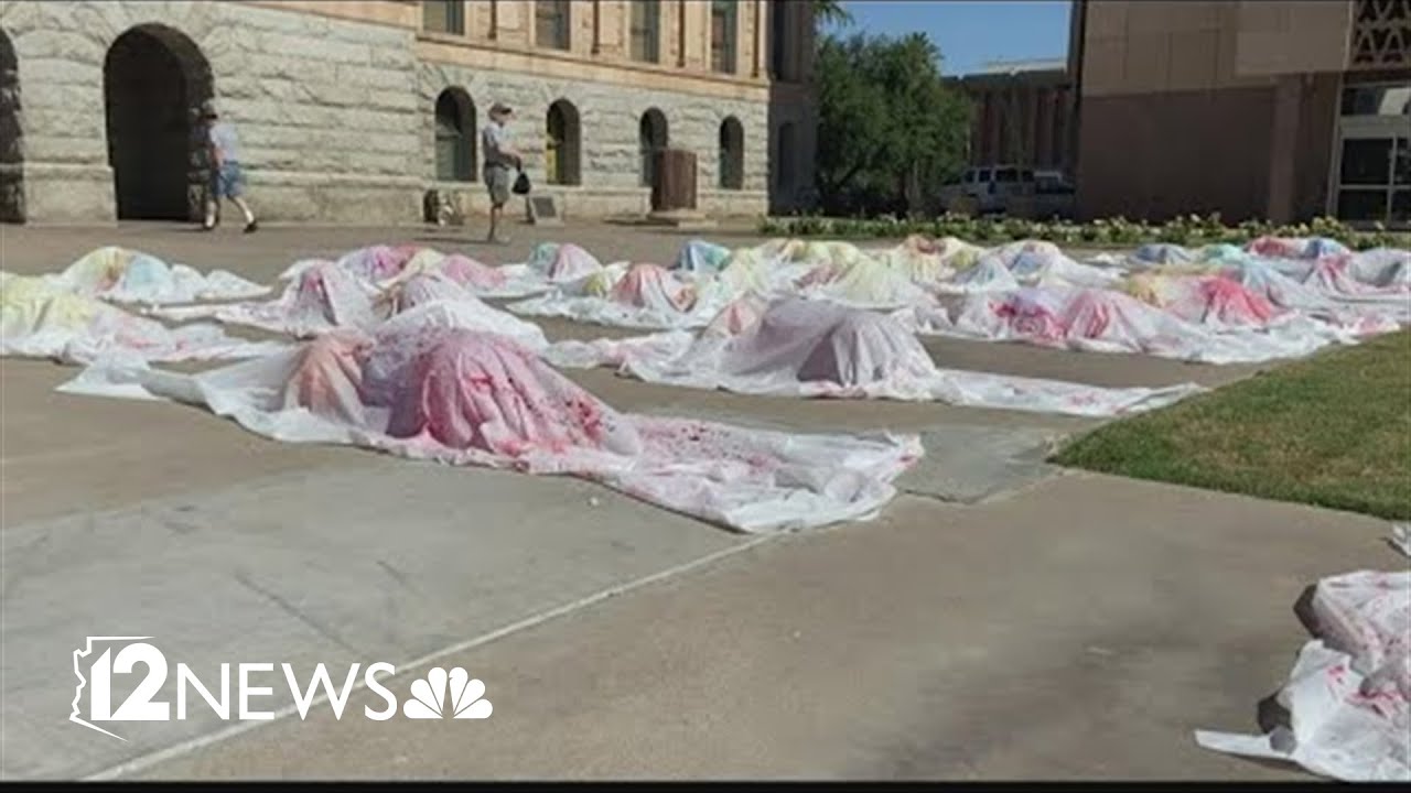 Activists use 'body bags' to protest for stricter gun laws in Arizona ...