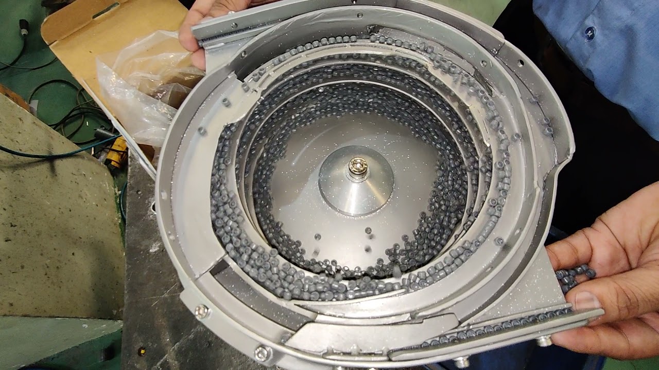 Small cap two outlet bowl feeder - 2 - YouTube