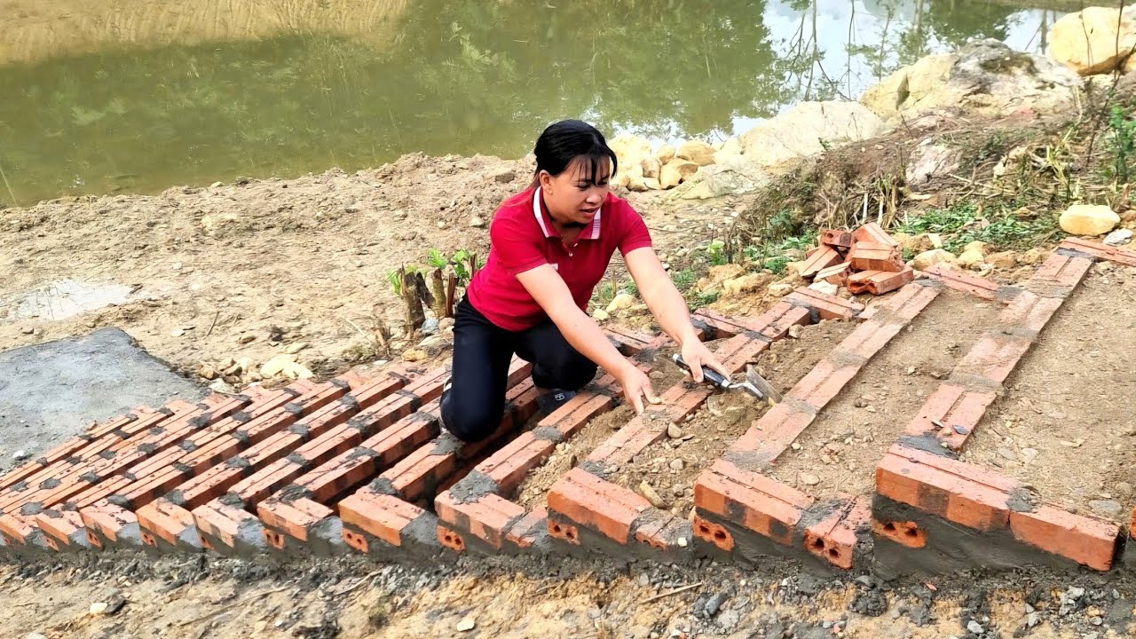 super long red brick pond staircase construction skills - YouTube