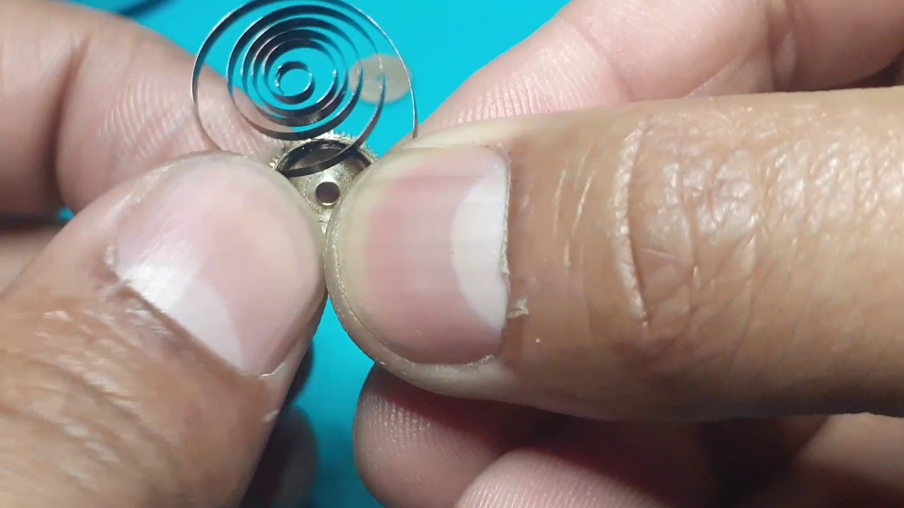 Old winding mainspring fitted in barrel using bare hands! - YouTube