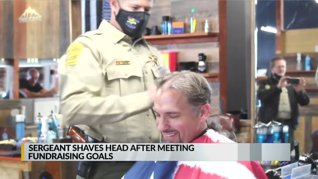 San Juan County police sergeant shaves head for a good cause - YouTube