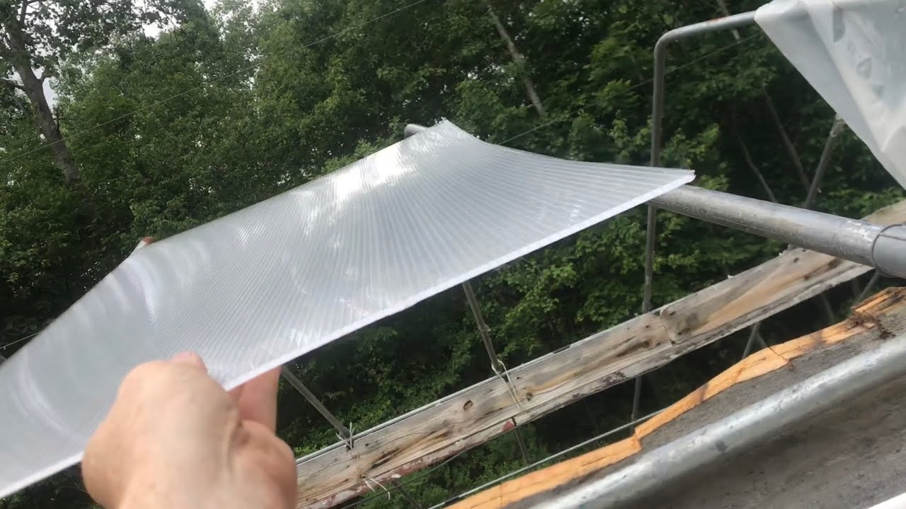 “installing” polycarbonate sheets on HIGH TUNNEL or greenhouse - YouTube