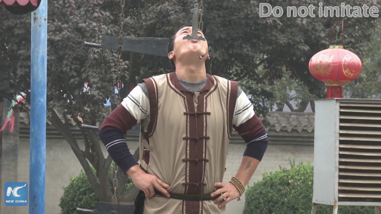 Swallowing sword: Death-defying stunt performed by Chinese artist - YouTube