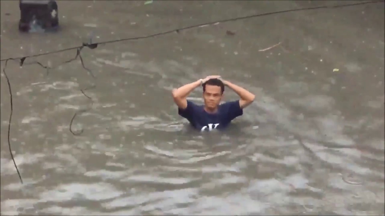 Locals Swim Through Flooded Streets After Tropical Depression Maring ...