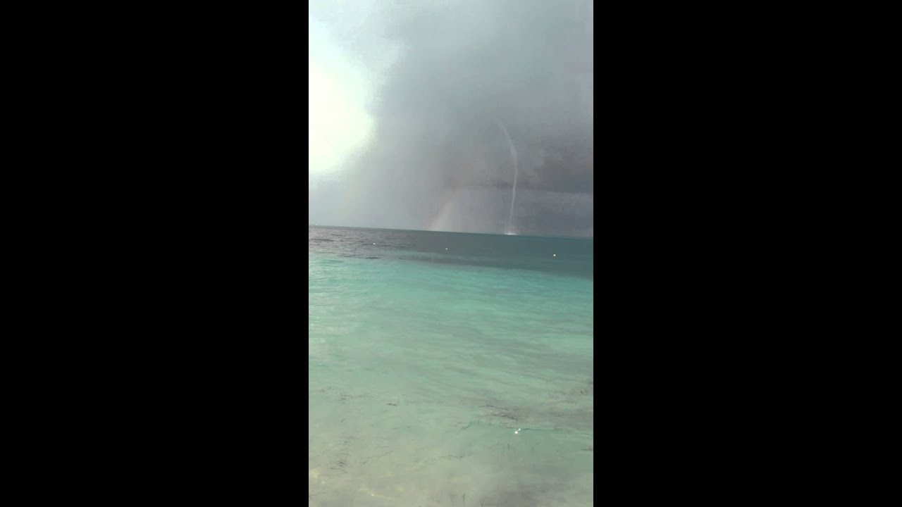 Water spout (tornado) and rainbow in Cancun - YouTube