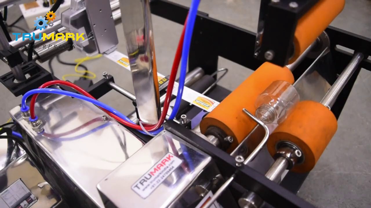 round bottle labelling machine with inkjet date printer - YouTube