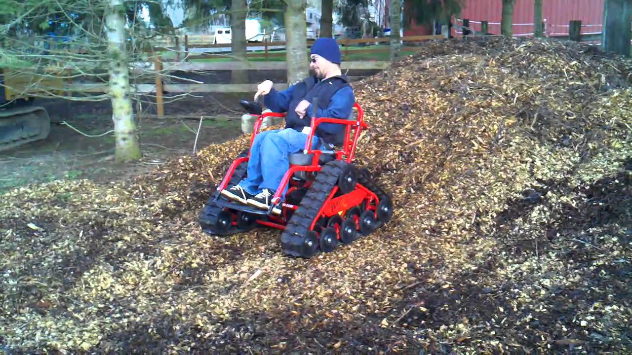 Action Trackchair in wood chips - YouTube