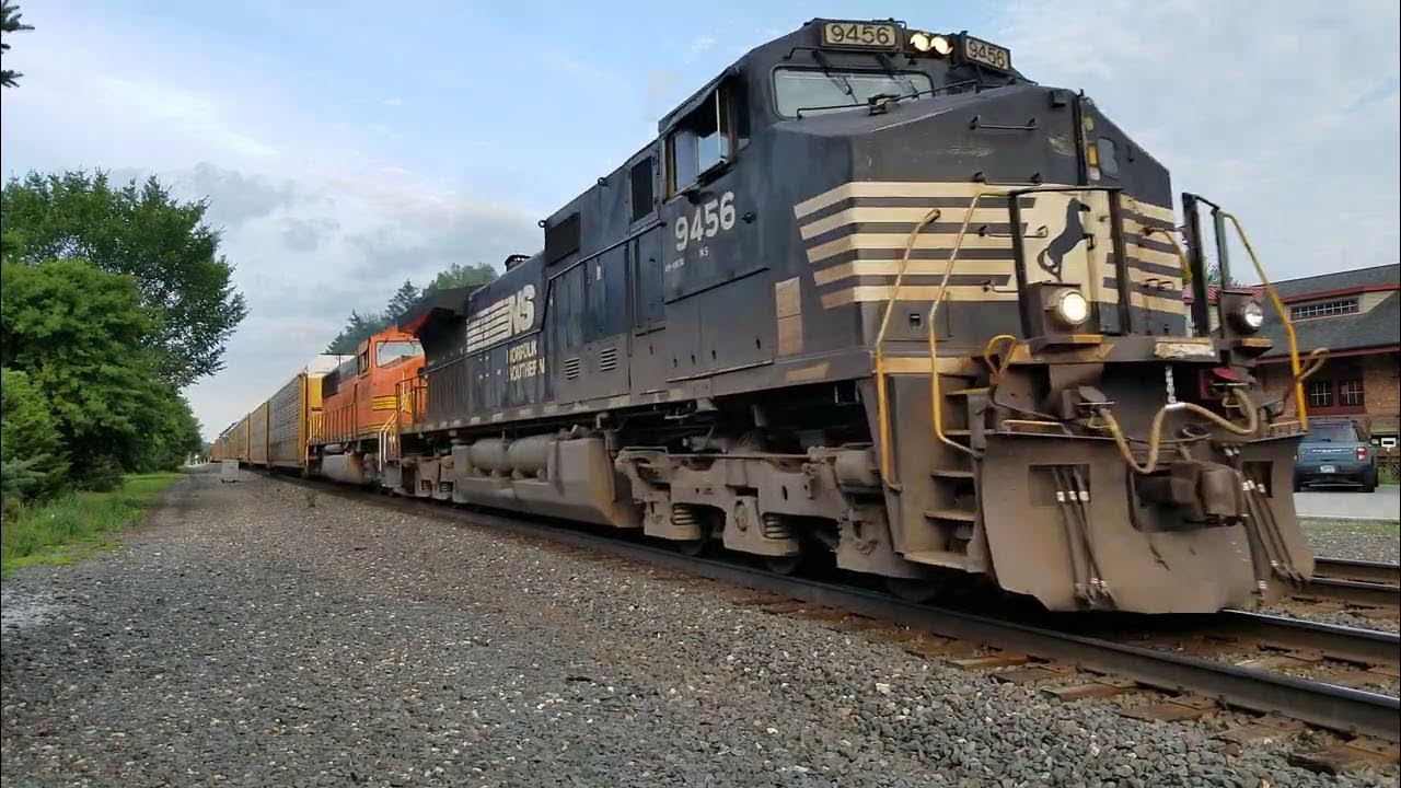 Original scheme NS Dash 9 and WFRX ex-BNSF SD70MAC leads an auto train through Chesterton - YouTube