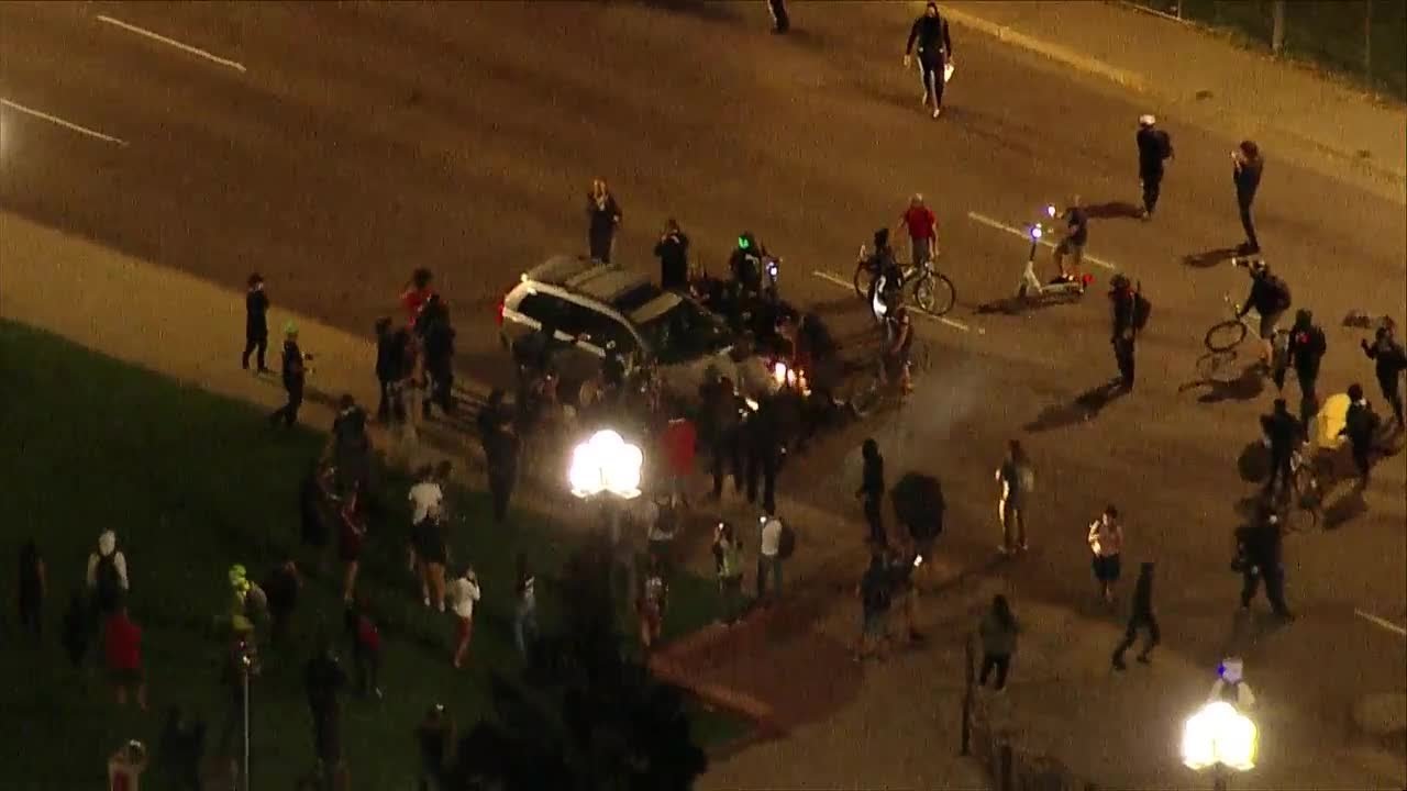 Full video: Man detained after running protester over with his car ...