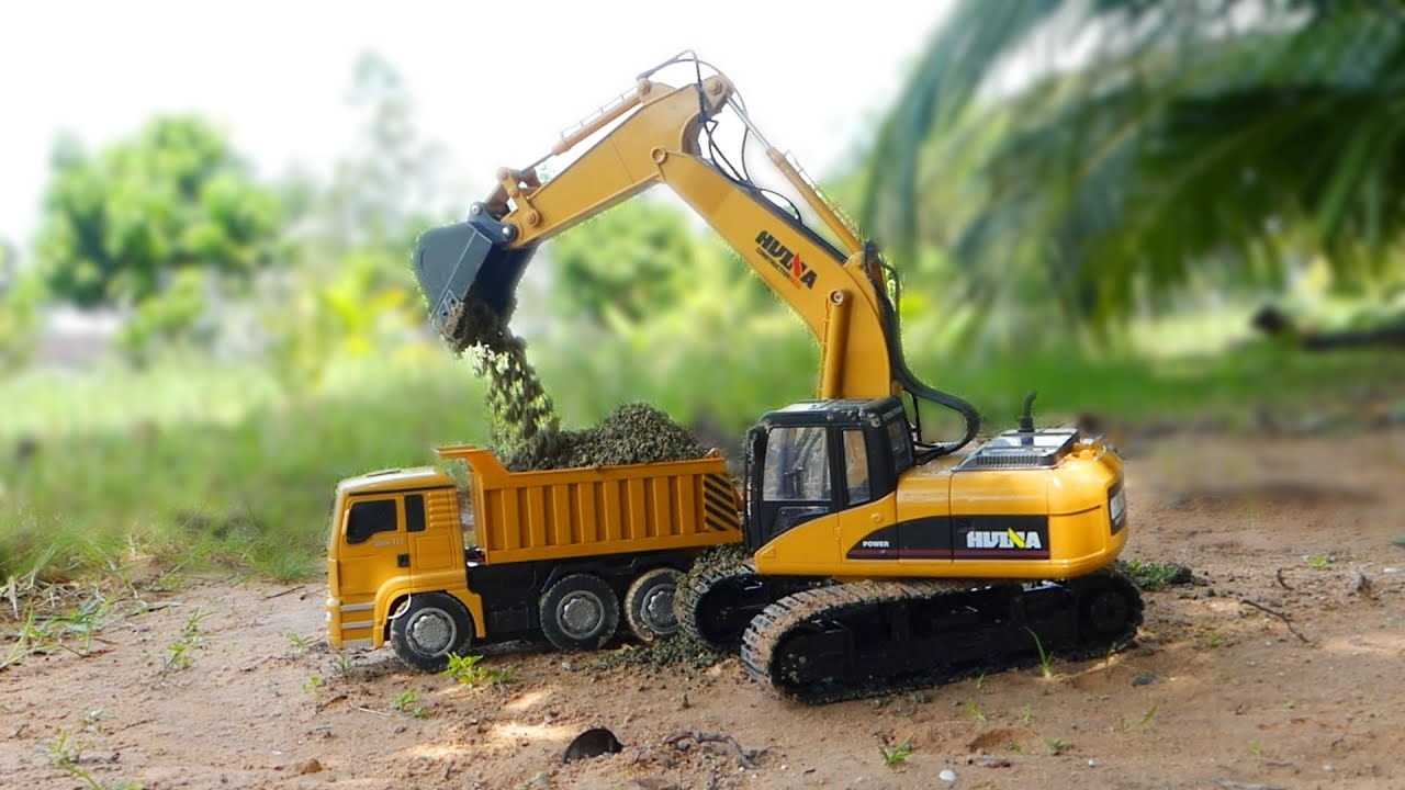 Construction RC Mini Excavator Loading Sand Into Dump Trucks and ...