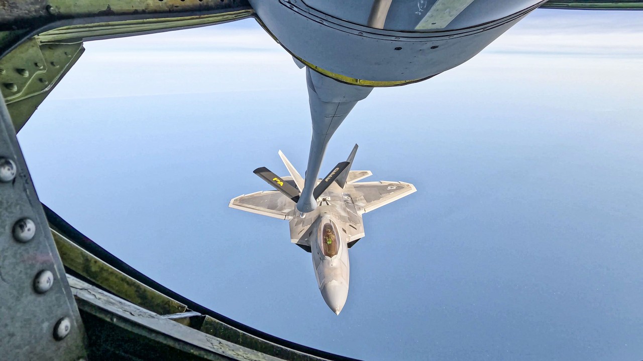 F-22 Raptor refuel with a KC-135 Stratotanker over the Atlantic Ocean ...