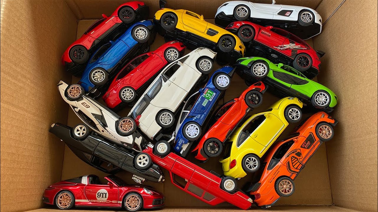 Box full of model Cars, Beetle, Lexus LM300H, Civic, SLR, Porshe911 ...