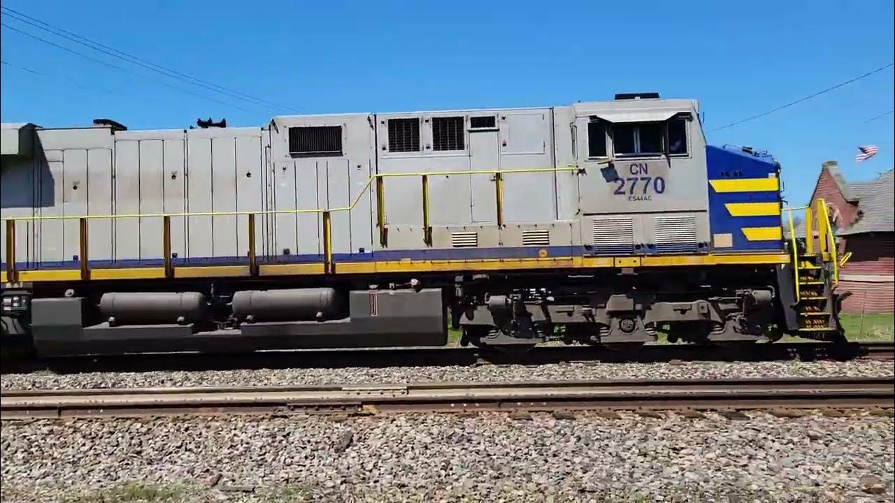 CN 2770, GECX 2029 Eastbound train with BN, BNSF, W&W hoppers, GTW/CN box cars at Vicksburg, MI ...