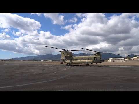 CH47 Chinook performs aerial fire suppression water bucket drops on the ...