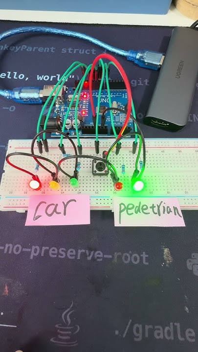Arduino-based traffic light system with pedestrian button interaction ...