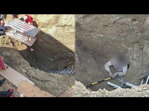 First responders rescue man after being trapped 20 feet down in hole ...