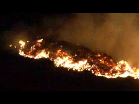 massive fire in hog fuel pile - YouTube