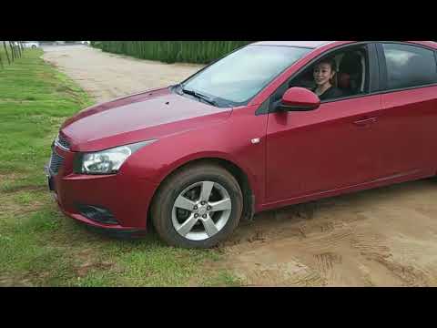 girl car stuck in mud revving pedal 007