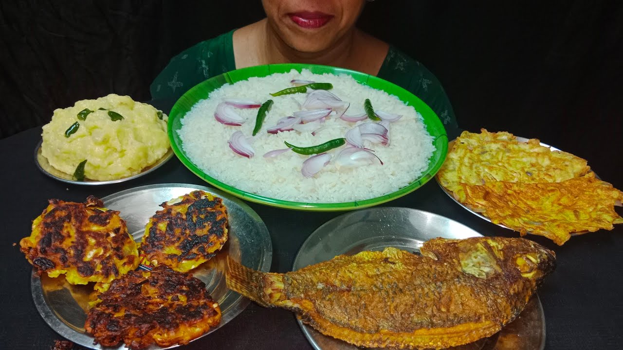 Eating water rice (panta Bhat) with fish fry egg omelette aloo bharta ...