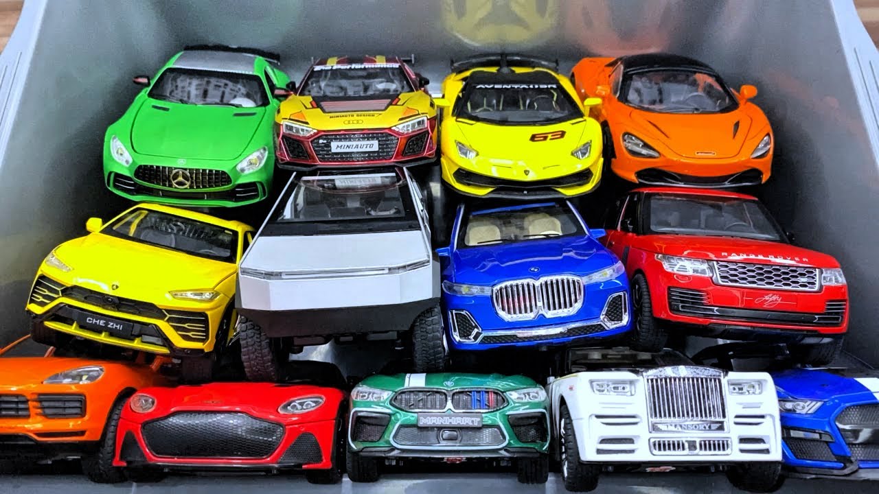 Box full of various miniature cars Peugeot, Jaguar, Pagani, Hyundai ...