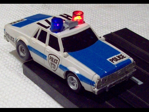 Aurora AFX Pursuit Police slot car with flashing LEDs - YouTube