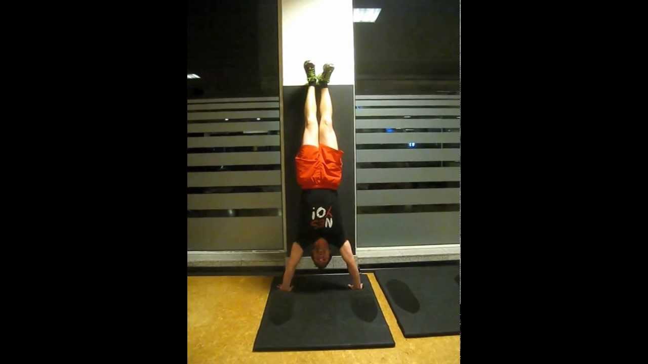 Wall Handstand - Step 3 of the Convict Conditioning Handstand Push Up ...