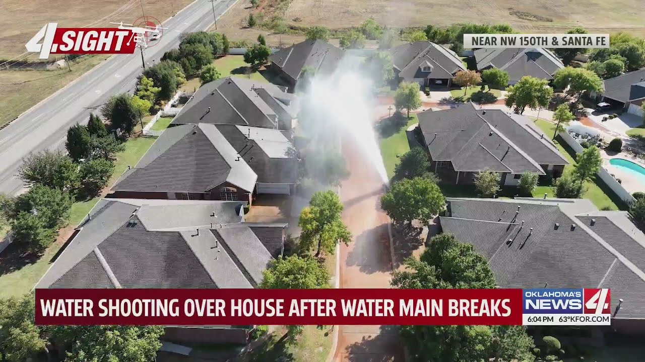 Water shooting over house after water main breaks - YouTube