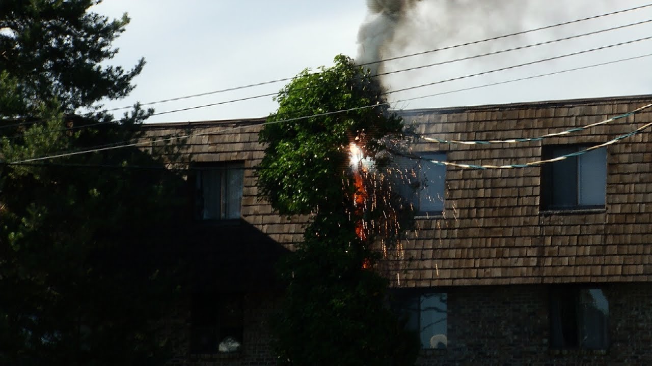 Building evacuated, as high-voltage power lines spark fire in ivy ...