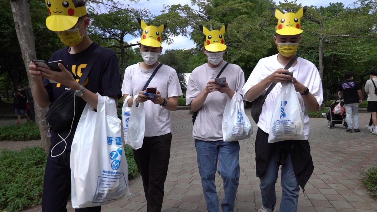 Pokémon fans meet for hunt in Taiwan park | AFP - YouTube