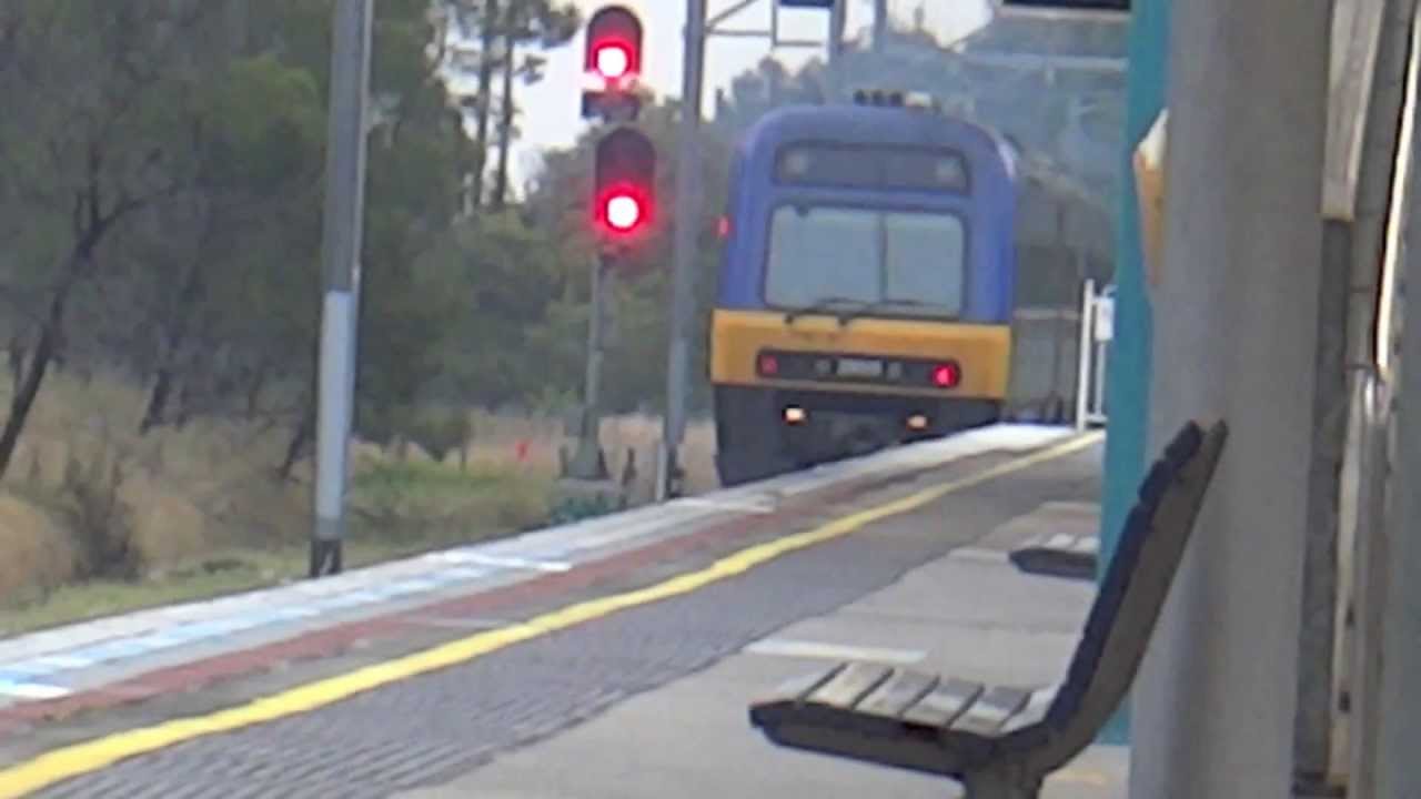 NSW TrainLink Endeavour units 2806 & 2859 passing Holsworthy Station ...